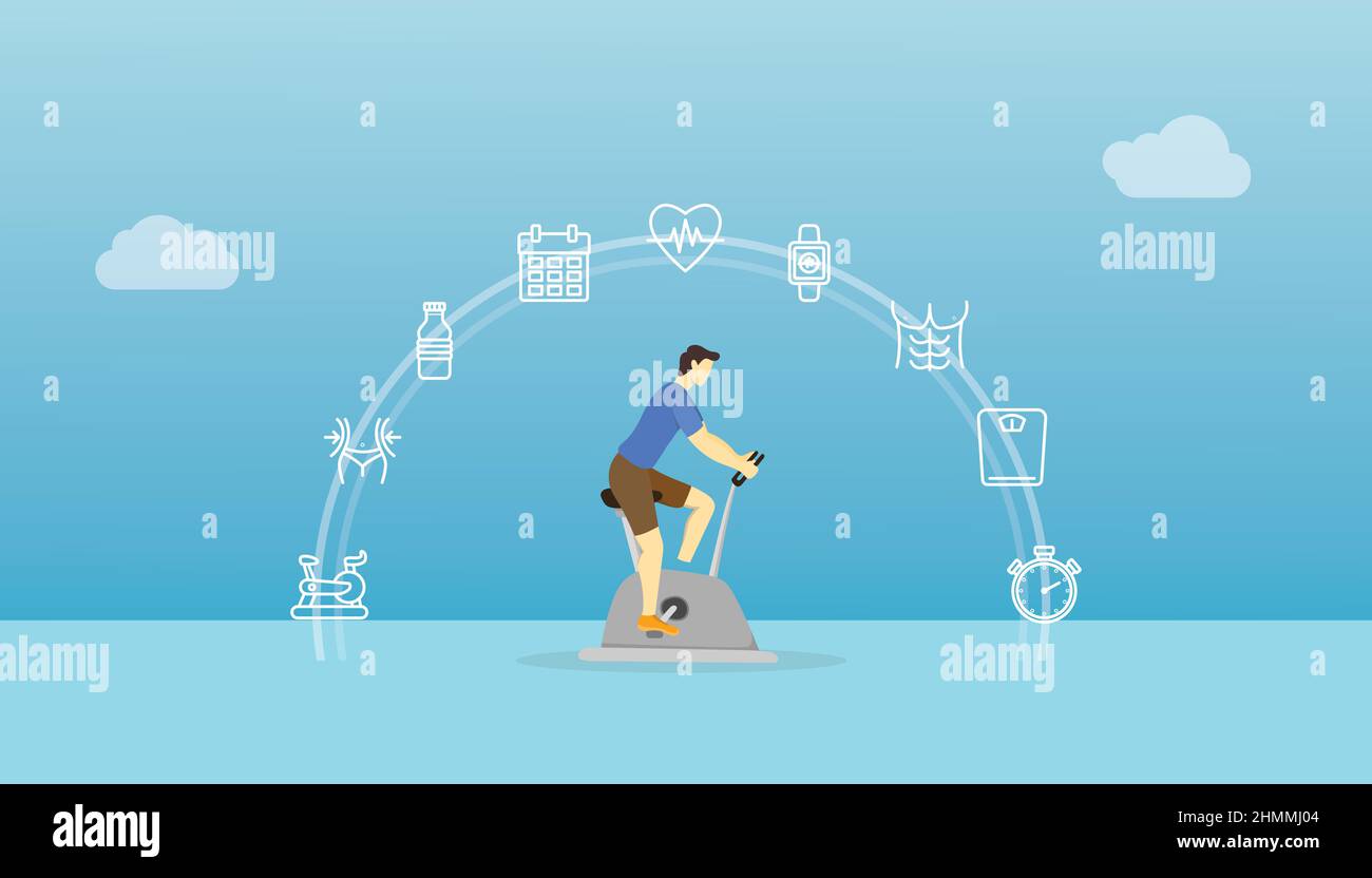 static bike or stationary bicycle concept with man cycling with some ...