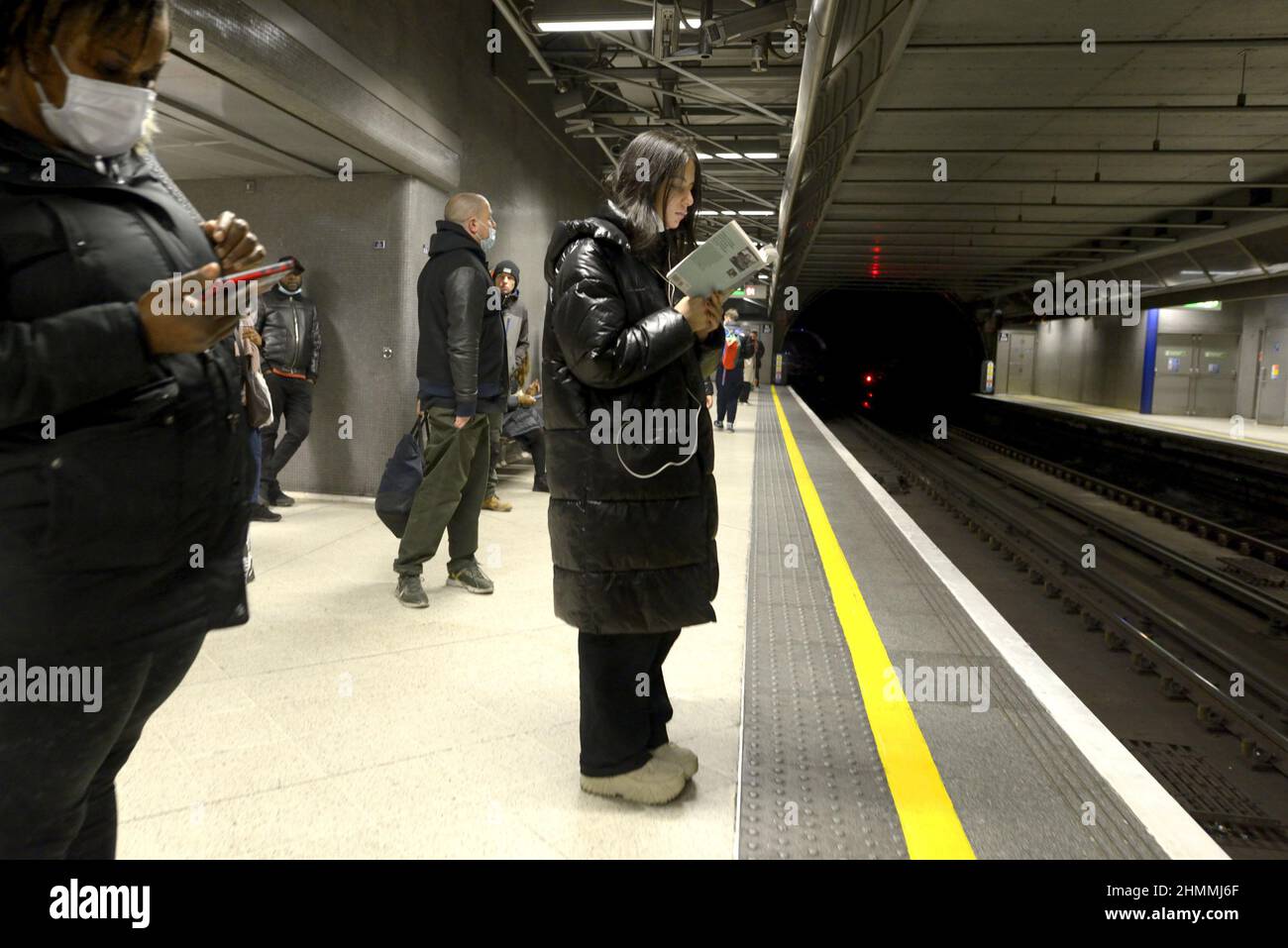 London, England, UK. London Underground: woman reading a book on a ...