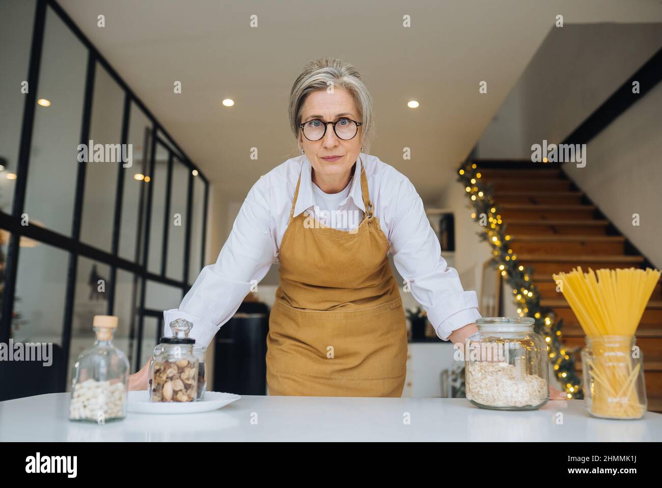 Portrait of strict granny standing in displeased pose staring angry Stock Photo - Alamy