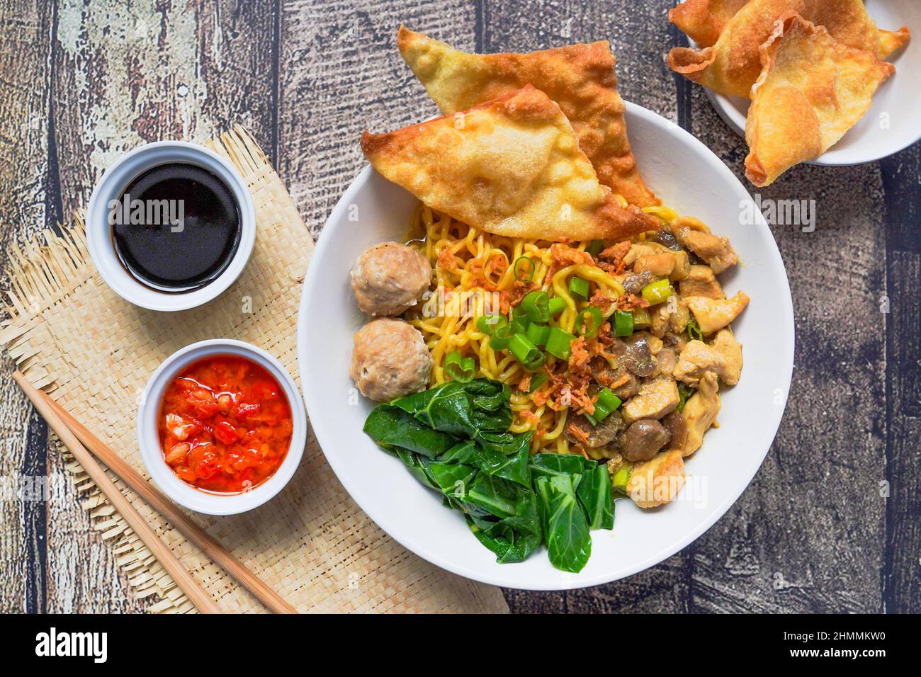 Indonesian famous street food Mie Ayam or chicken noodles served with ...