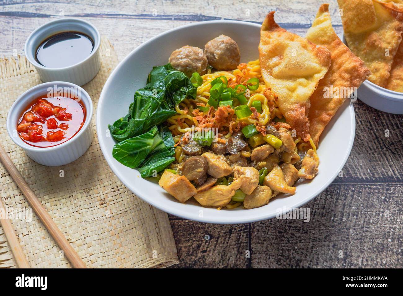 Indonesian famous street food Mie Ayam or chicken noodles served with ...