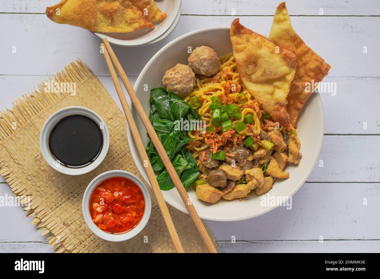 Indonesian famous street food Mie Ayam or chicken noodles served with ...