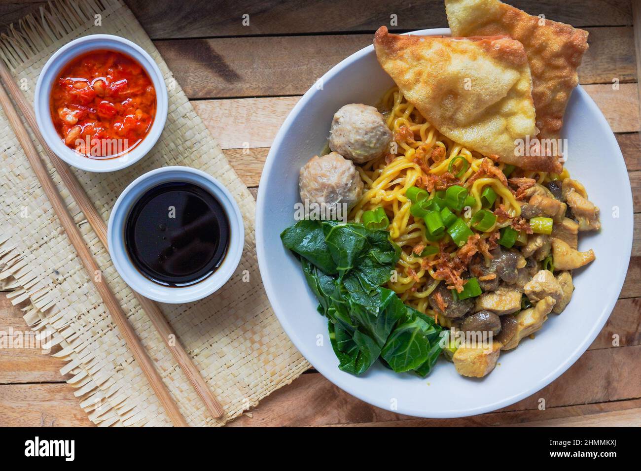 Indonesian famous street food Mie Ayam or chicken noodles served with ...