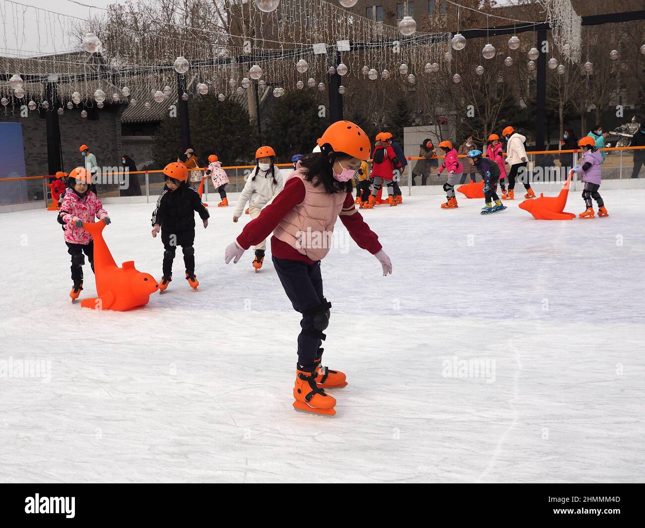 BEIJING, CHINA - FEBRUARY 11, 2022 - Tourists skate to keep fit at the ...