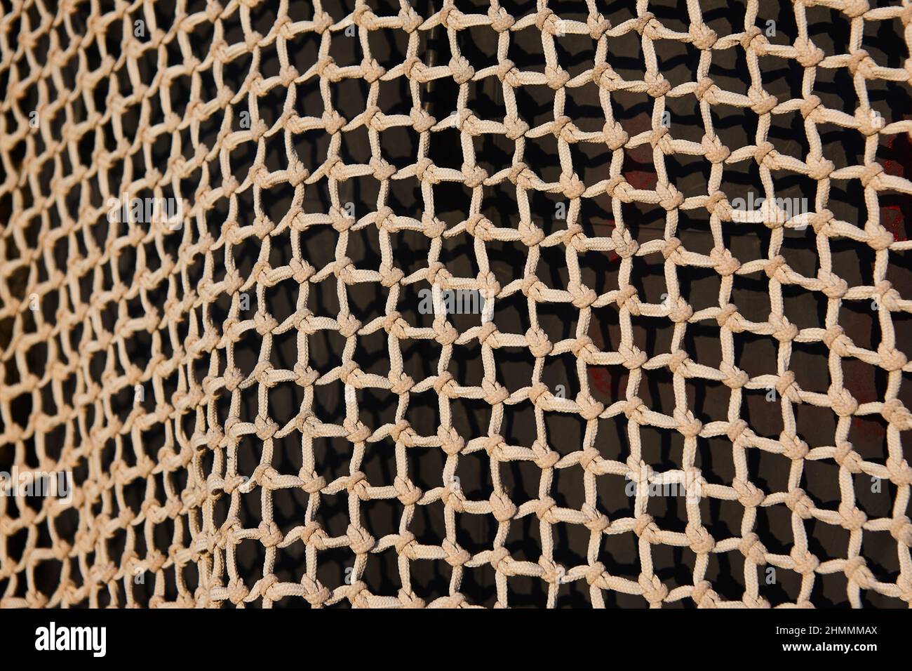 Fishing net under a black background. Fishery equipment. Marine Stock ...