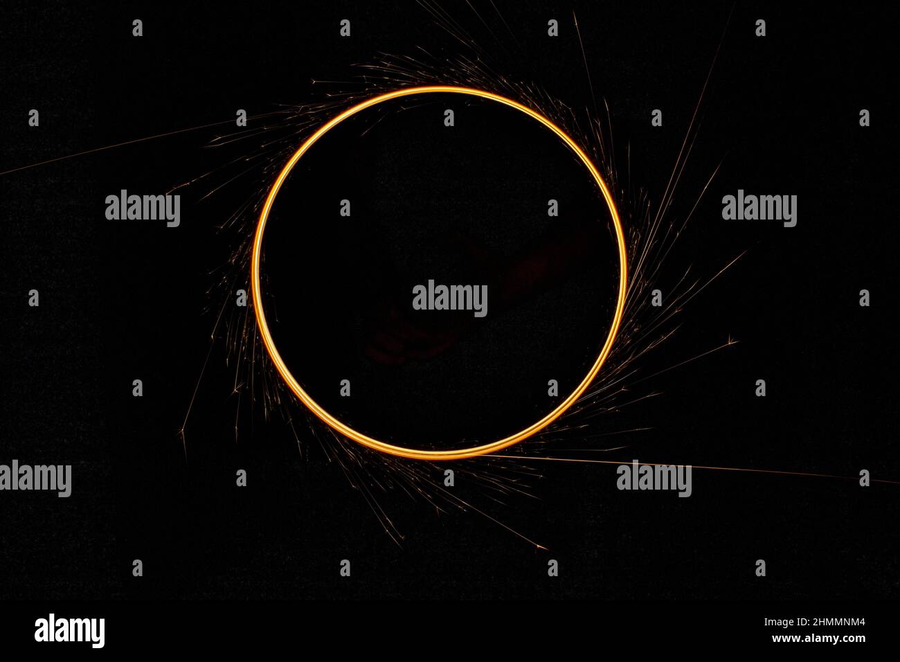 Circular lights with sparks on a black background Stock Photo - Alamy