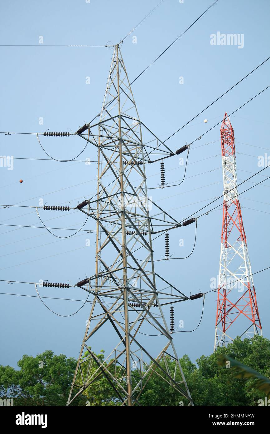 Two electric poles of different colors Stock Photo - Alamy