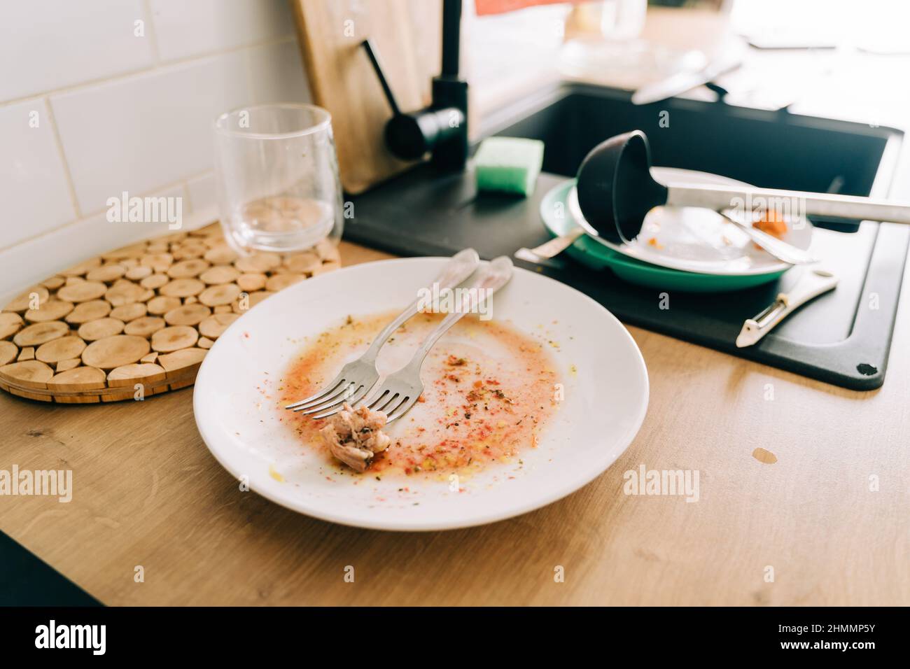 Wooden kitchen tabletop with black sink and dirty messy dish Stock ...