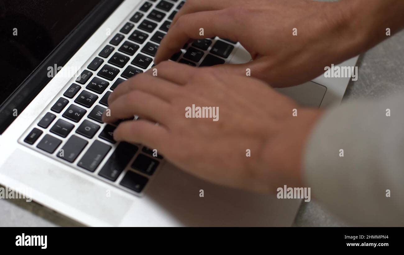 Hand typing on laptop keyboard, personal computer use for work at ...