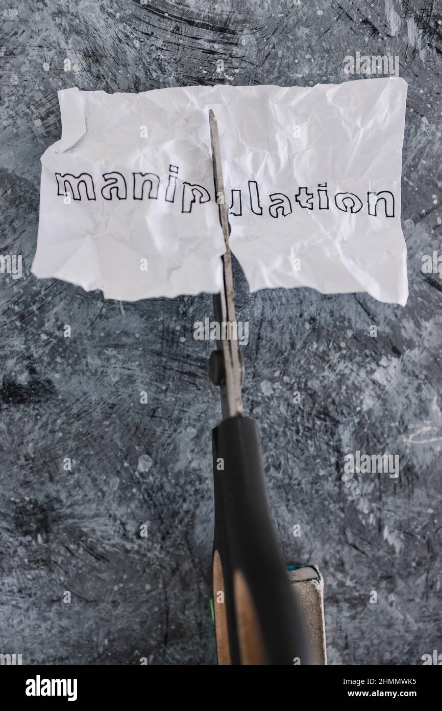 Manipulation text on crumpled piece of paper which is getting cut with ...