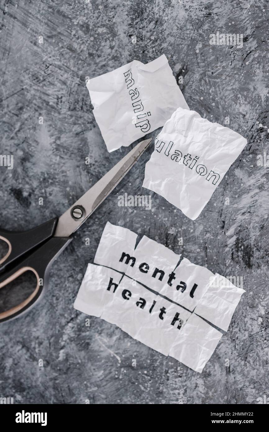 Manipulation text on crumpled piece of paper which is getting cut with ...