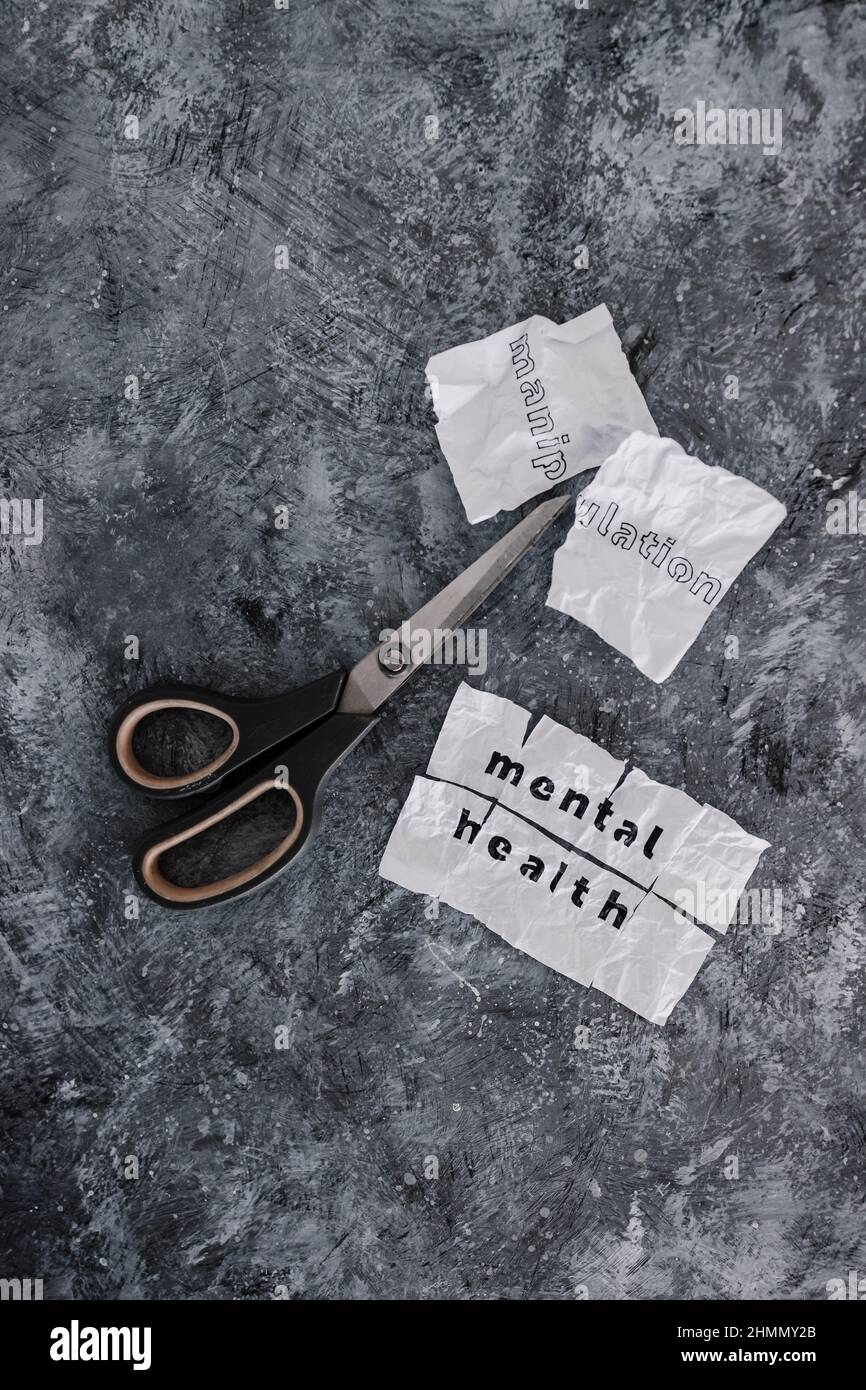 Manipulation text on crumpled piece of paper which is getting cut with ...