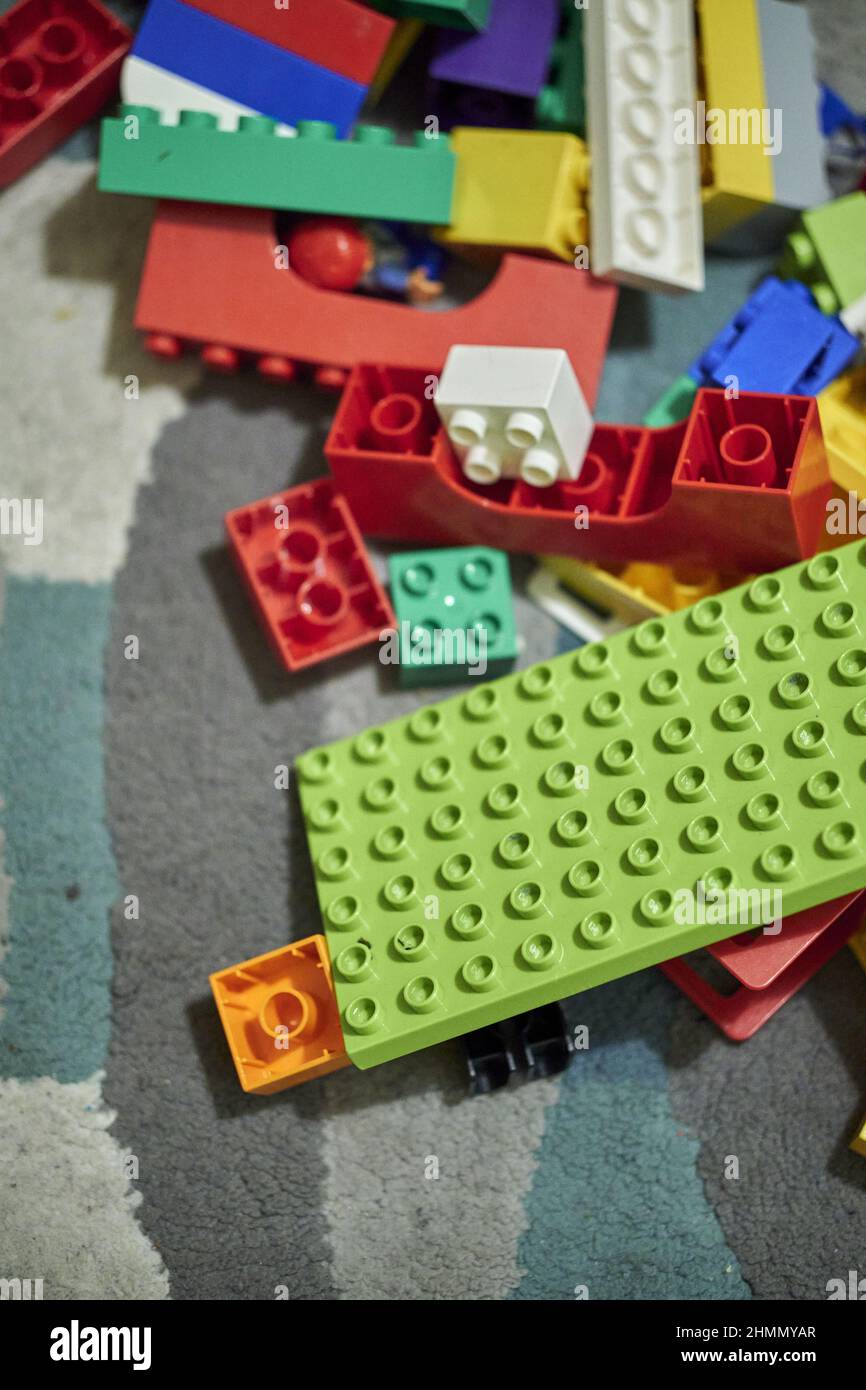 Lego Duplo mix of plastic toy bricks laying on a carpet Stock Photo - Alamy