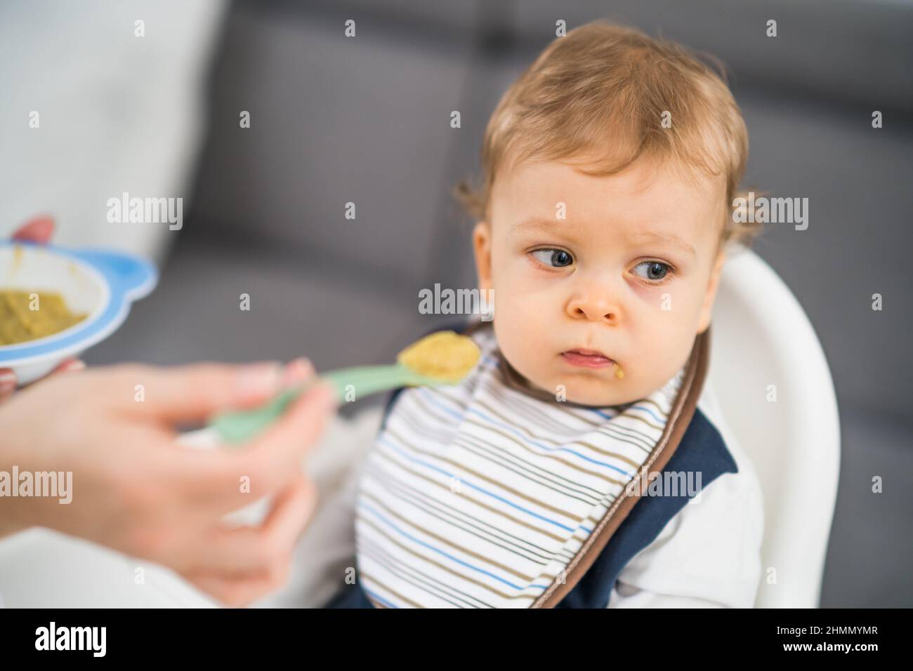 Angry baby boy doesn't want to eat Stock Photo - Alamy