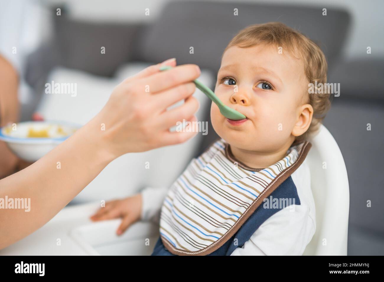Baby in high chair enjoying hi-res stock photography and images - Alamy
