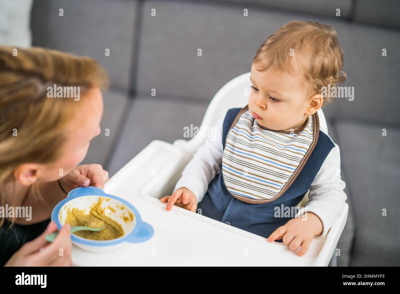 Angry baby boy doesn't want to eat Stock Photo - Alamy