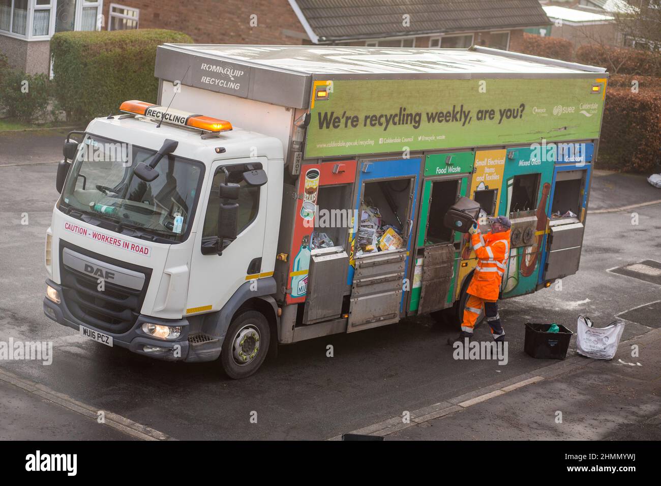 A household recycling waste lorry collects rubbish from homes in ...