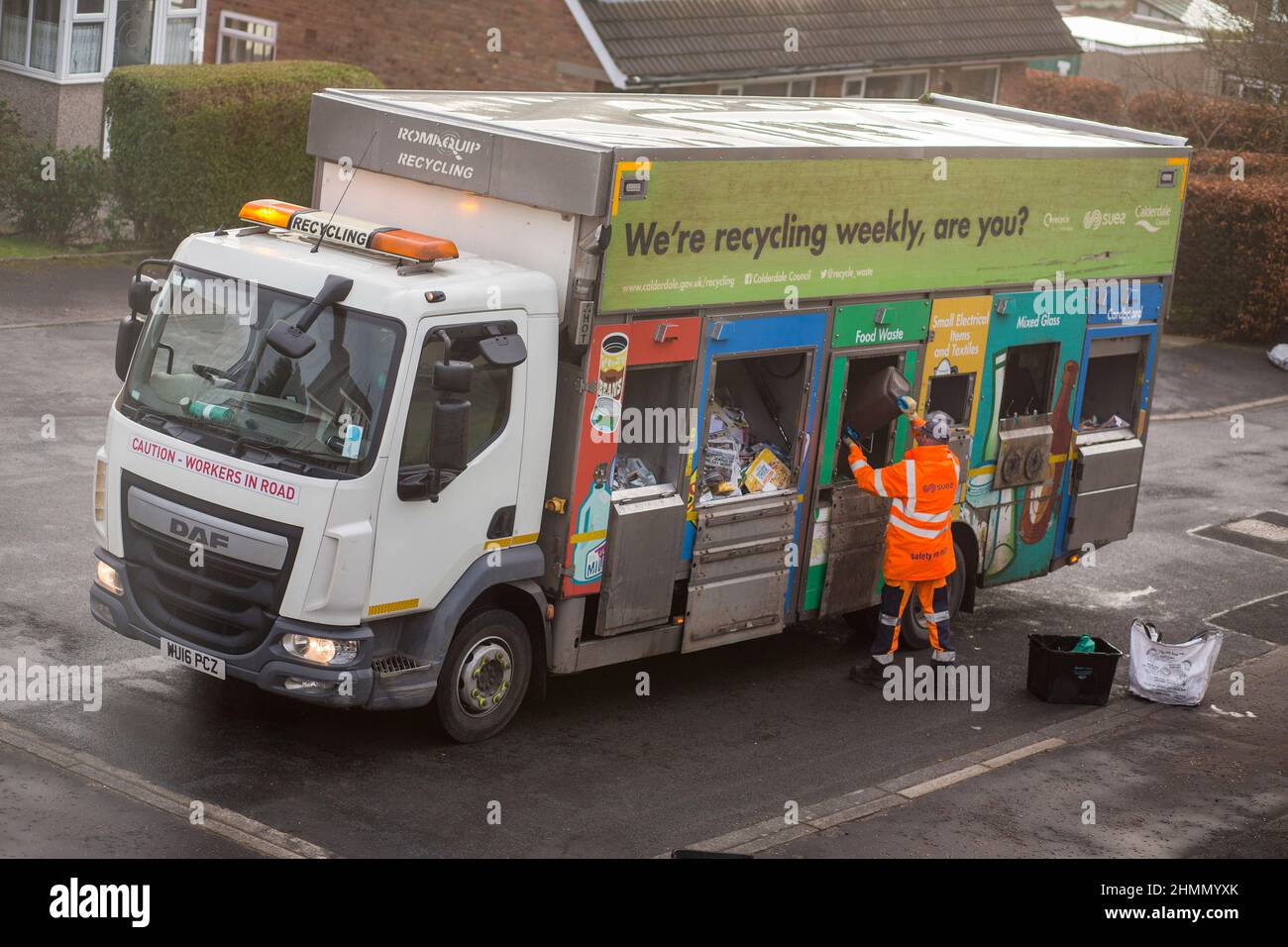 A household recycling waste lorry collects rubbish from homes in ...