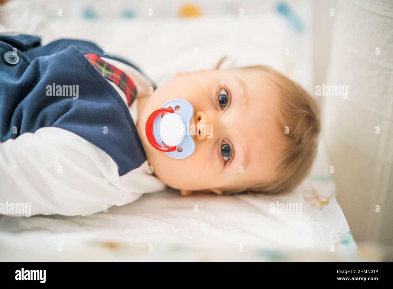Close up portrait of cute baby boy with pacifier Stock Photo - Alamy