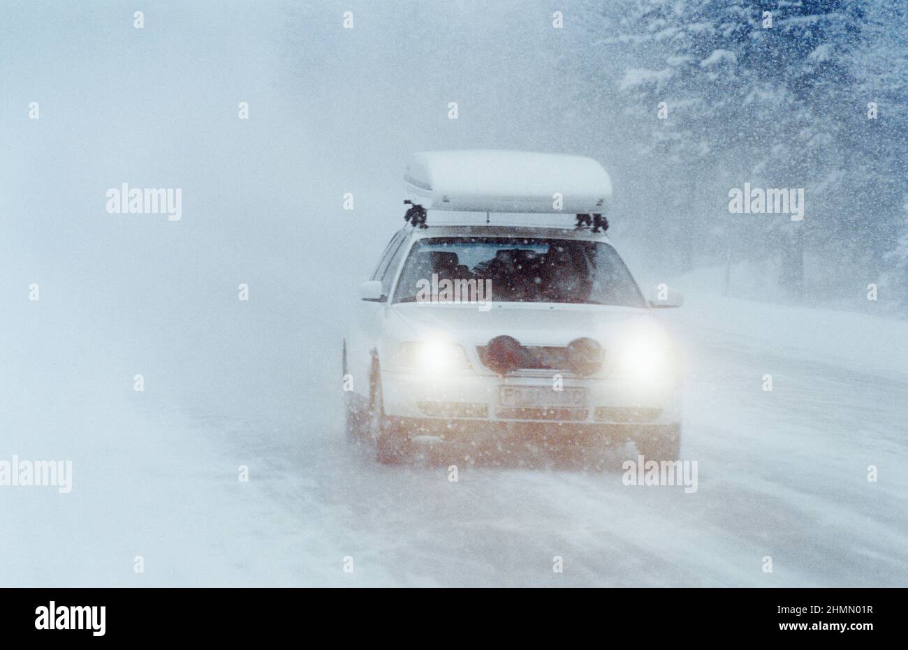 Car driving i snow storm Stock Photo - Alamy