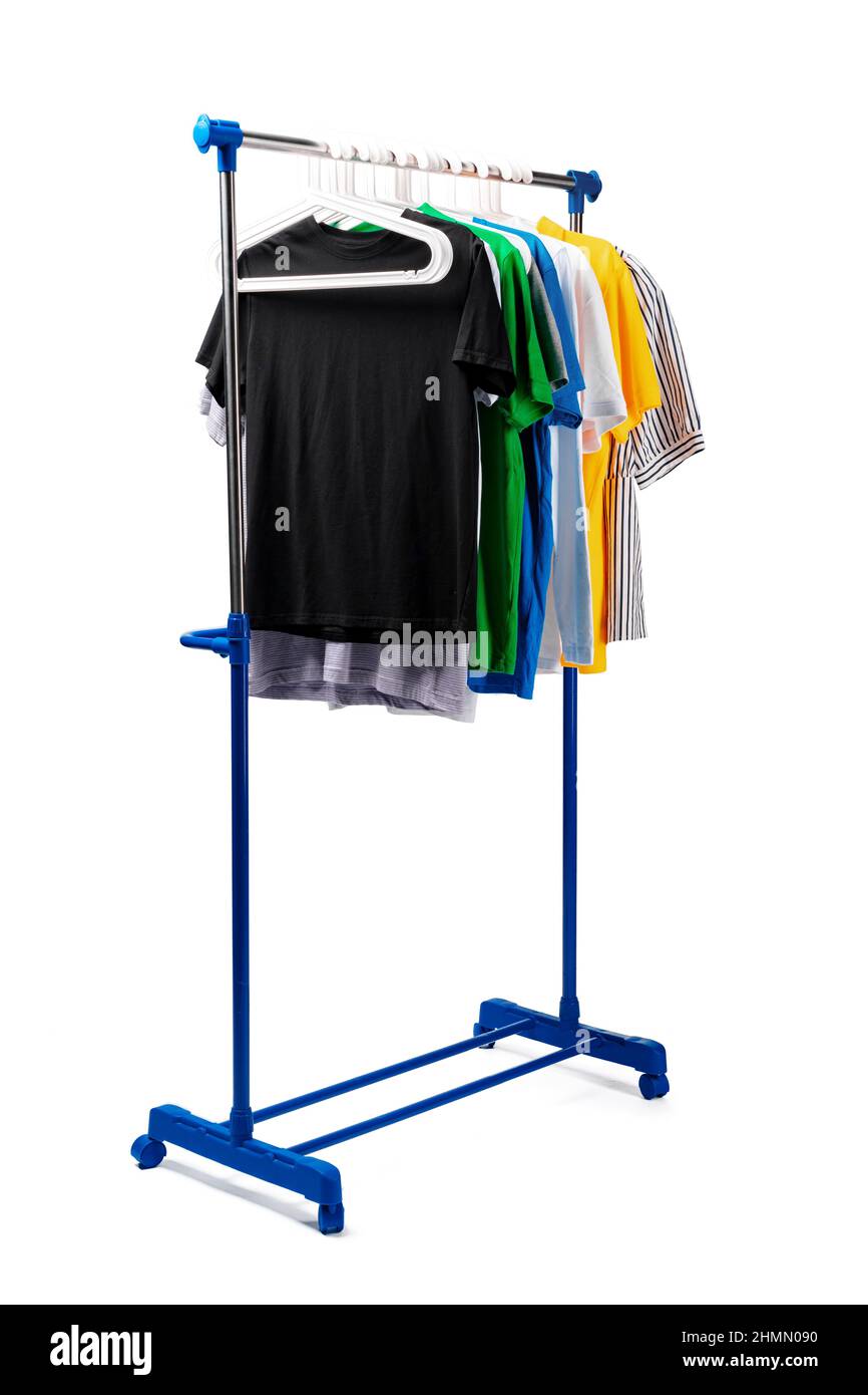 Clothes hang on clothing rack over white background Stock Photo - Alamy