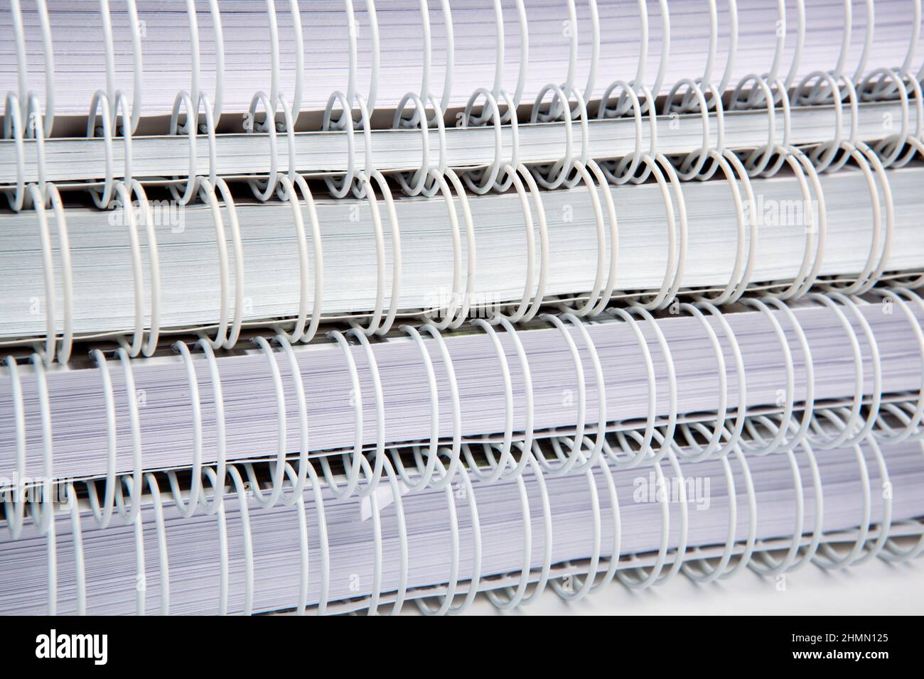 stack of large white notebooks as background Stock Photo - Alamy