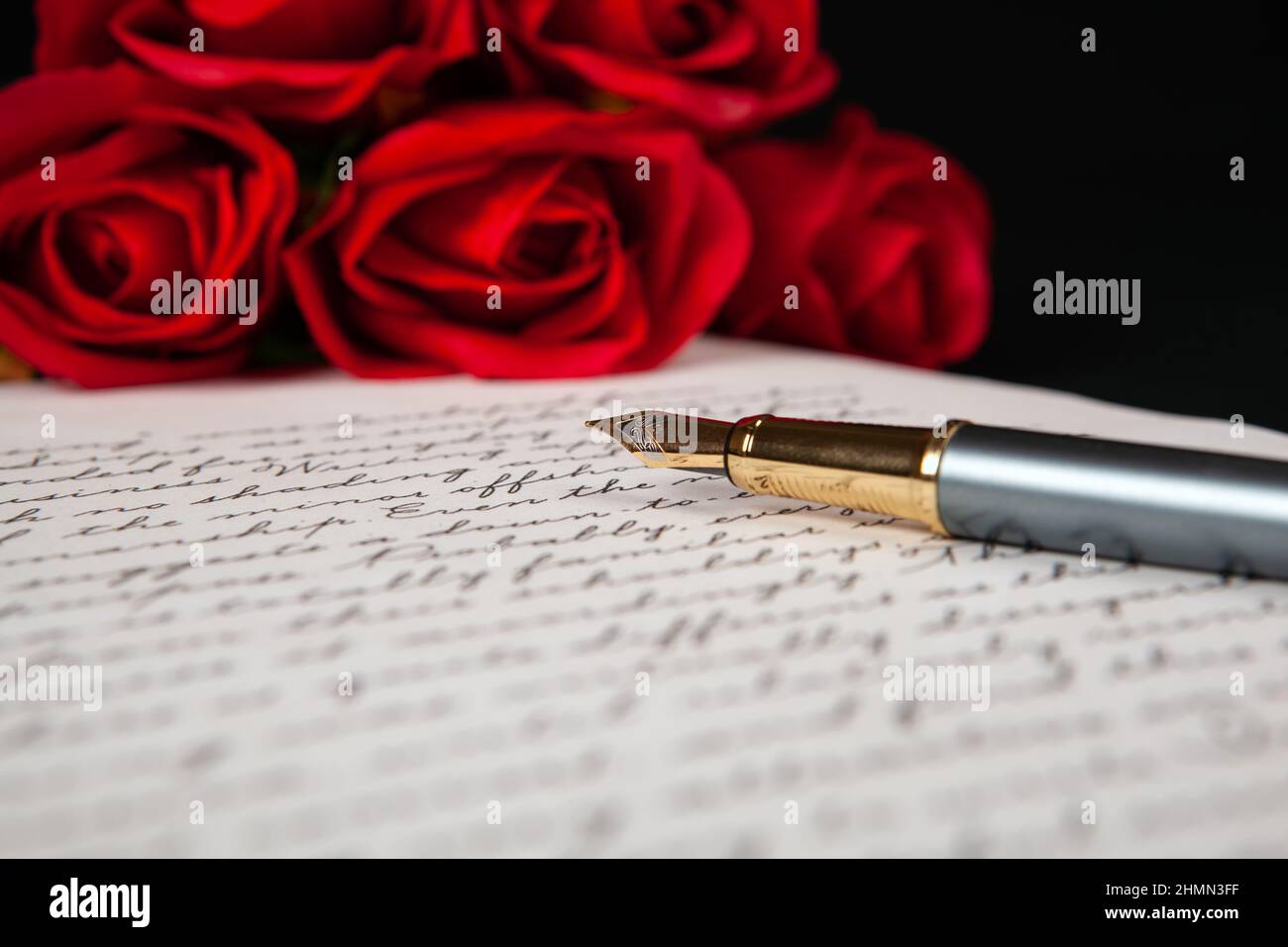 fountain pen on letter with text and red roses close up Stock Photo - Alamy