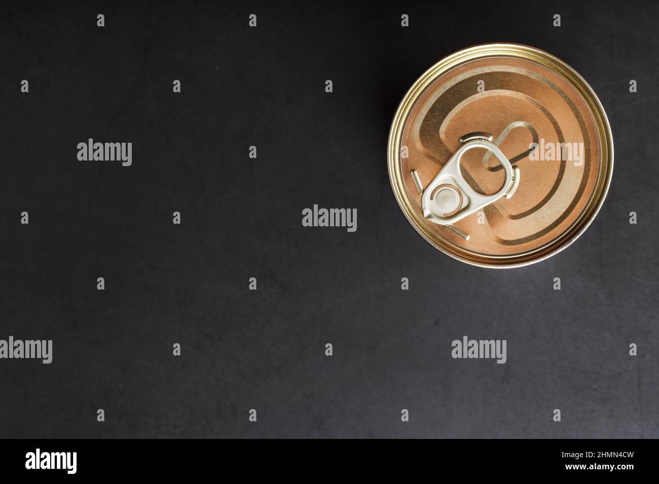 A can with a metal lid and a ring for opening. Top view Stock Photo - Alamy