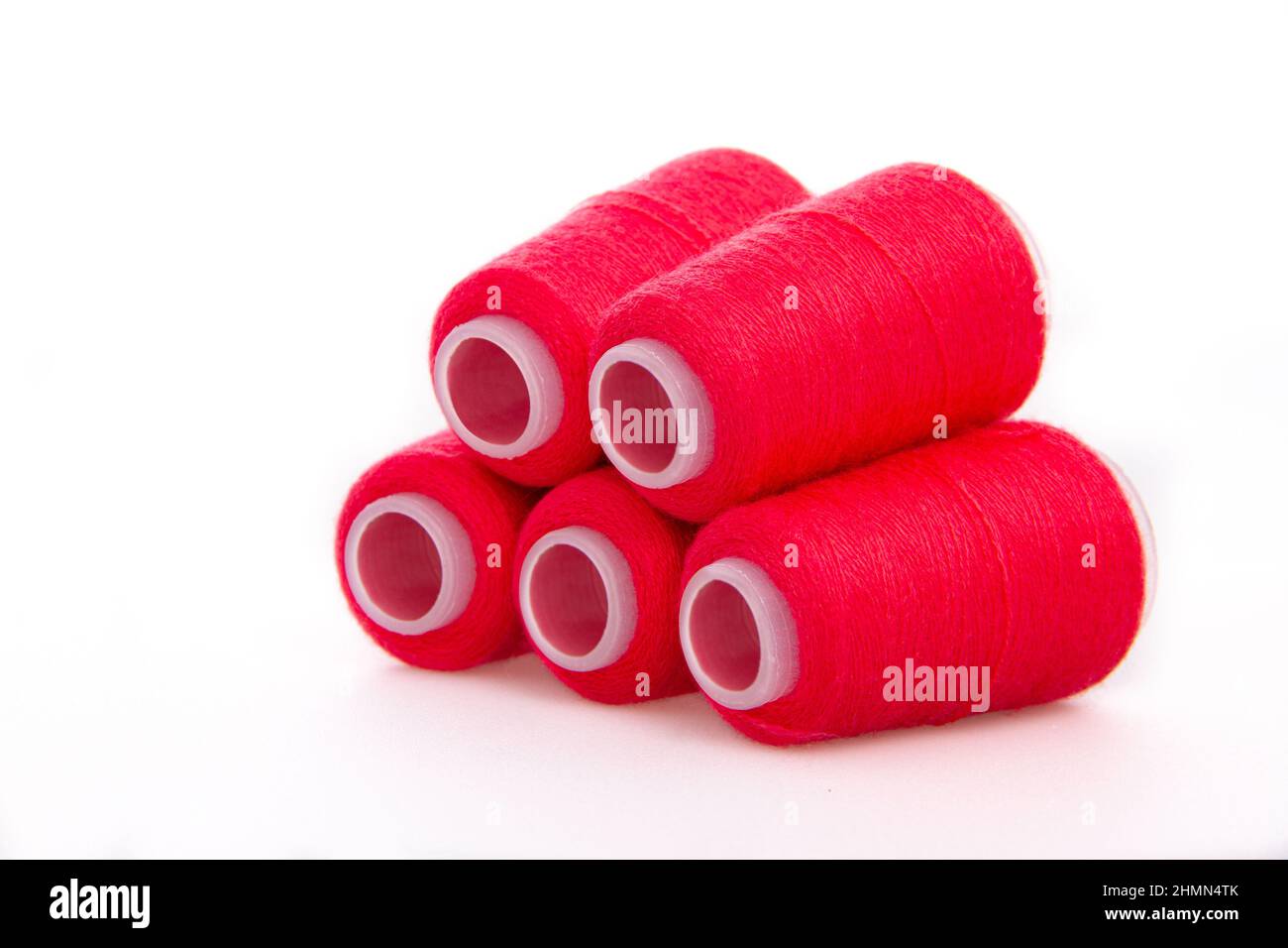 Red spool of thread isolated on white background. Skein of woolen ...