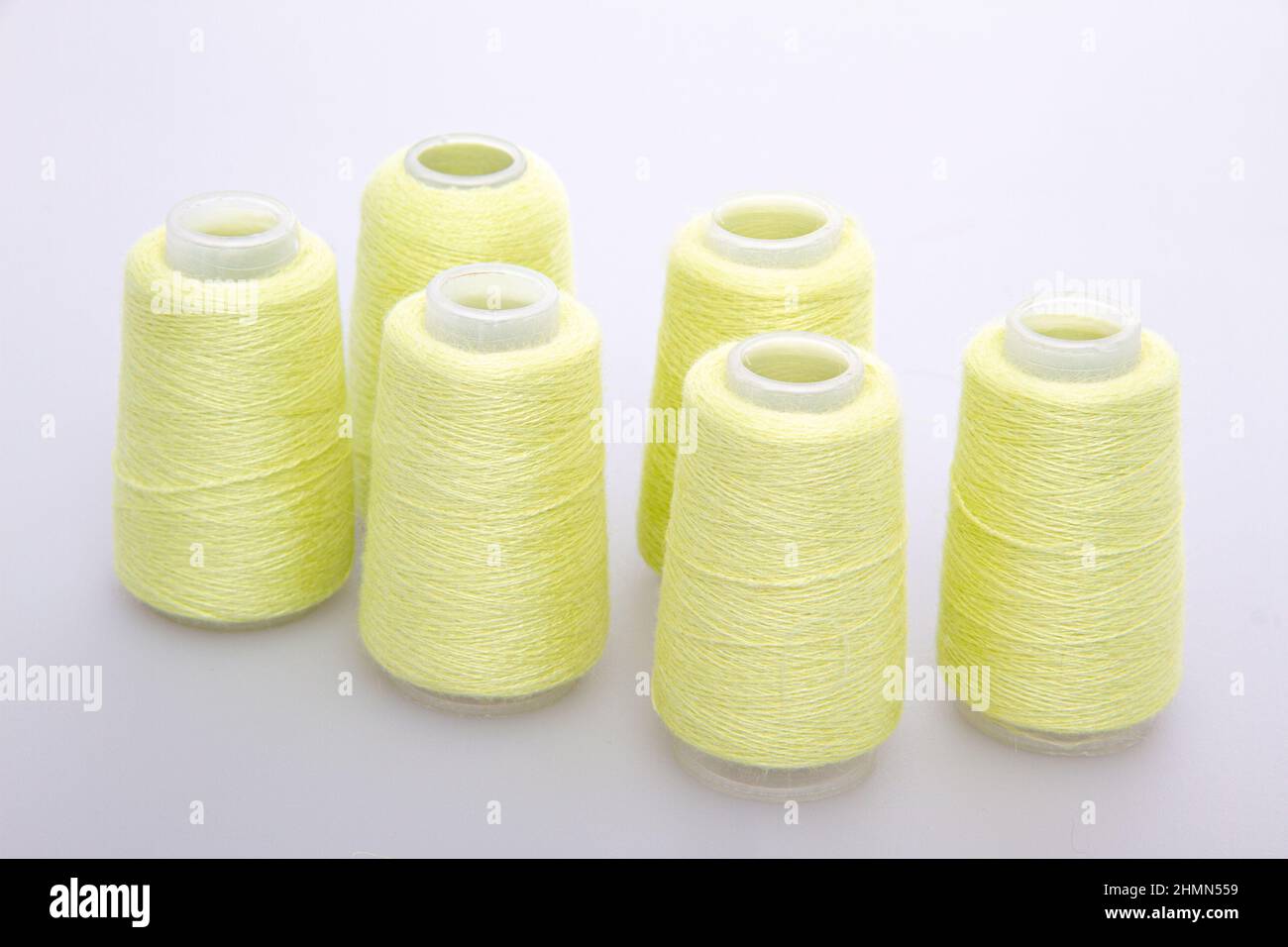 Yellow spool of thread isolated on white background. Skein of woolen ...
