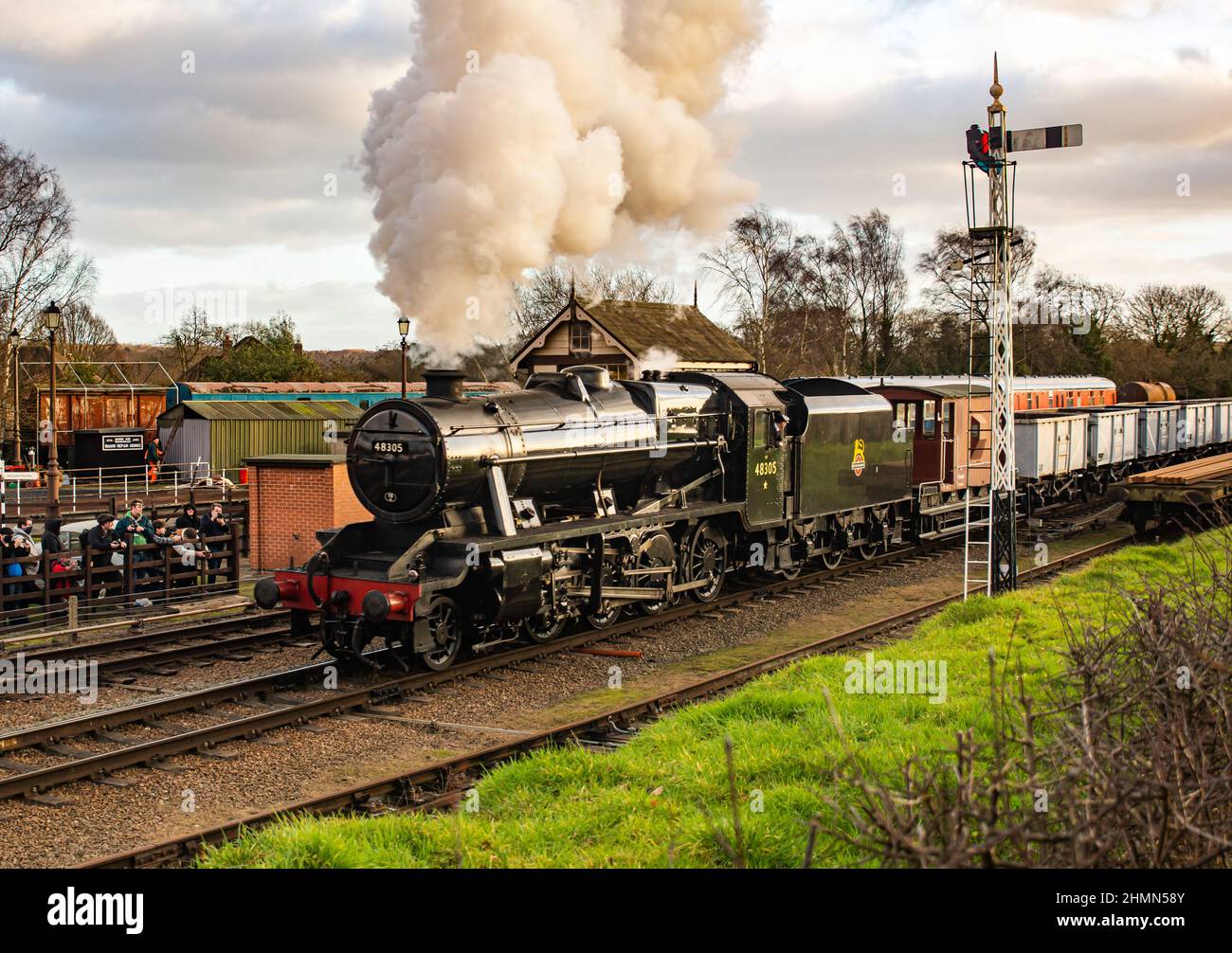Steam locomotive 8F Class 2-8-0 No.48305 hauling a goods train into ...