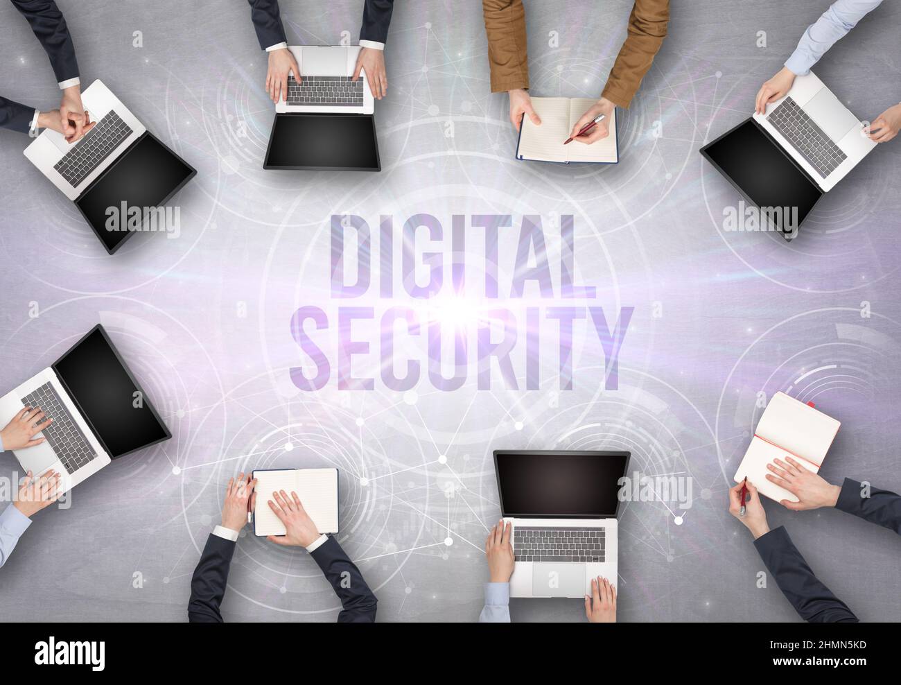 Group of people in front of a laptop, security concept Stock Photo - Alamy