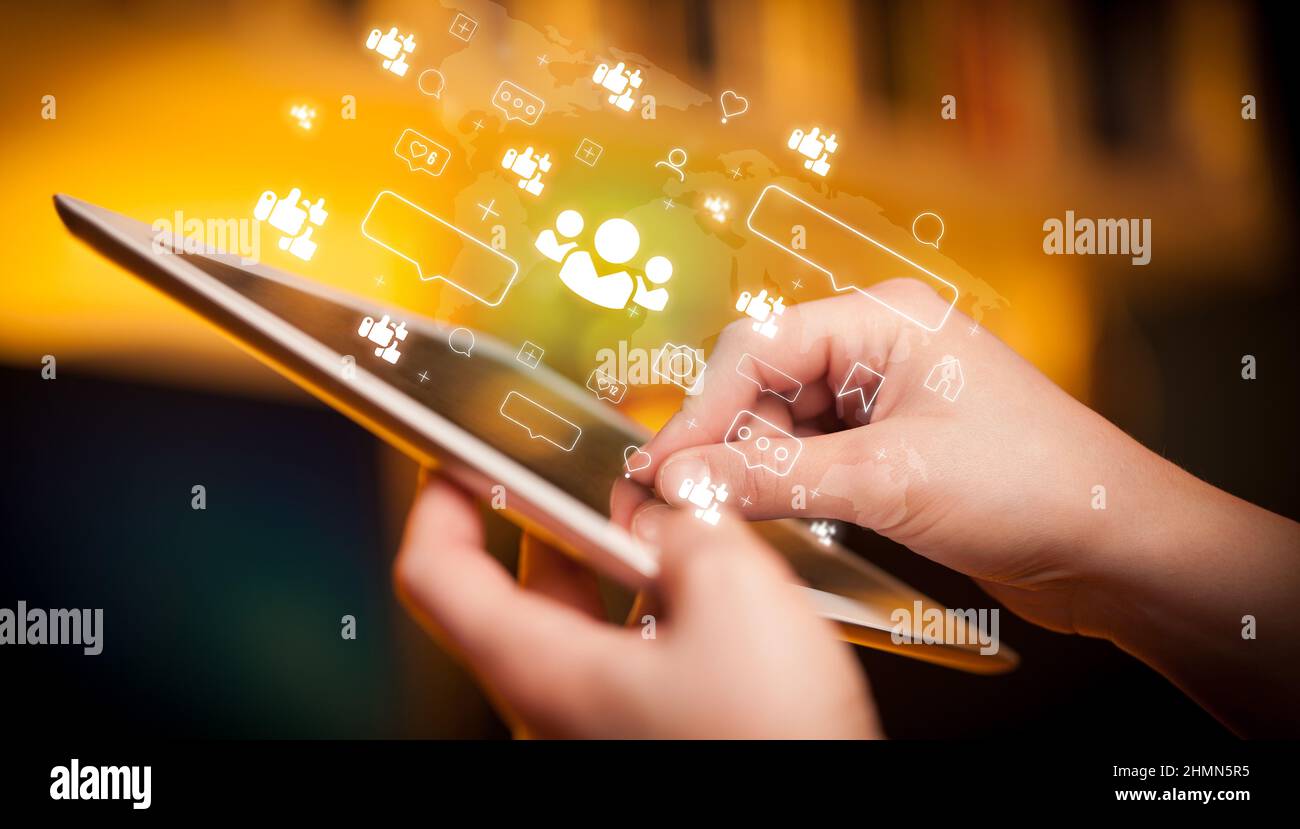Close-up of a hand using tablet, social media concept Stock Photo - Alamy