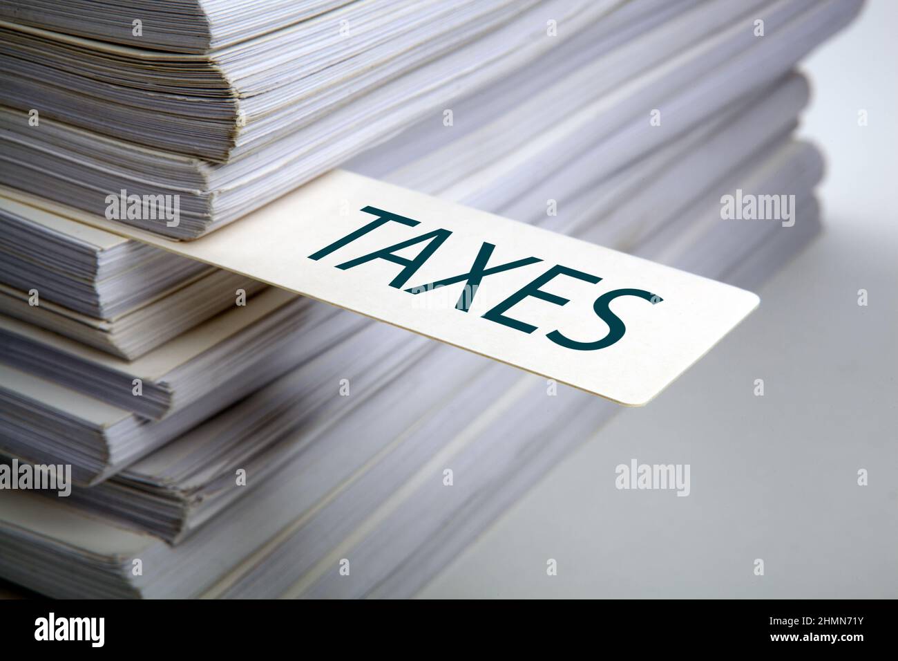 bookmark labeled taxes in the stack of documents close up Stock Photo ...
