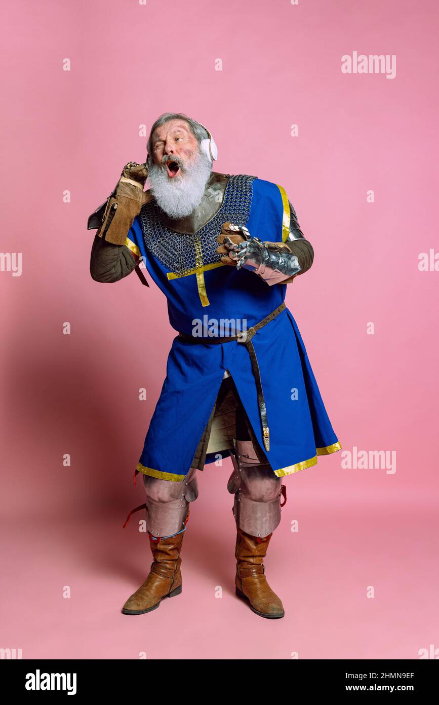 Portrait of senior grey bearded man, brave medieval warrior or knight ...