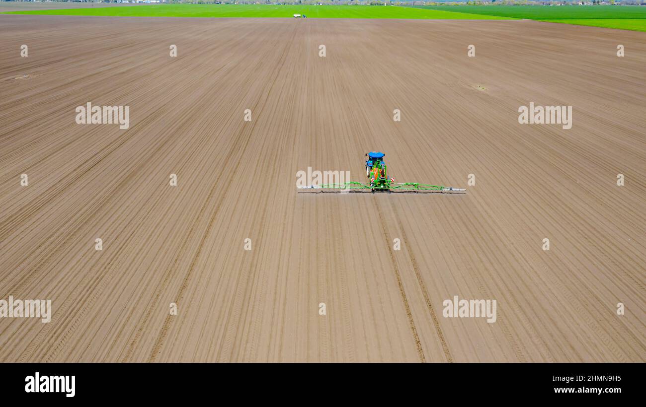 Above view, overhead view on tractor until spraying big endless ...