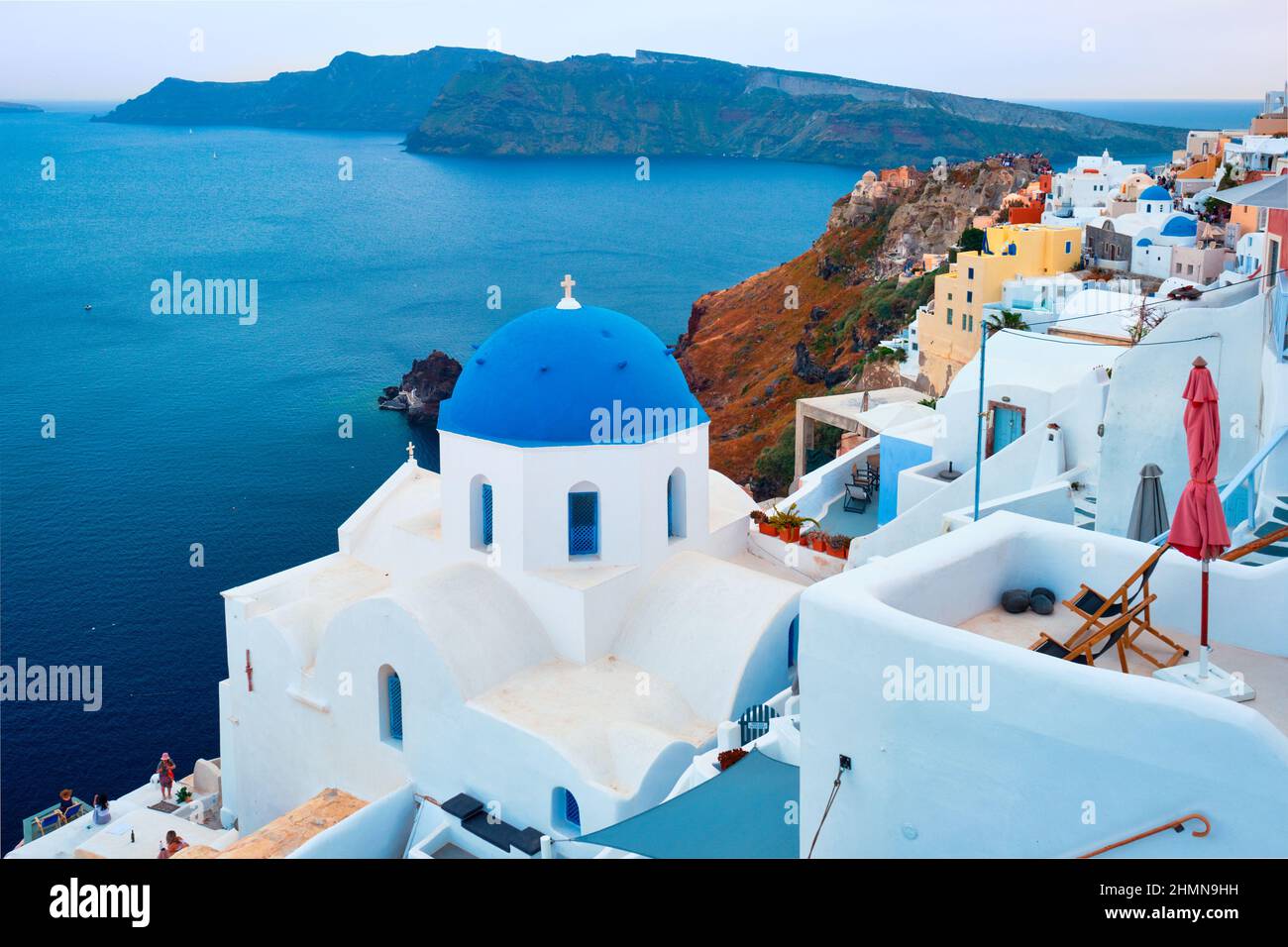 Famous view from viewpoint of Santorini Oia village with blue dome of ...