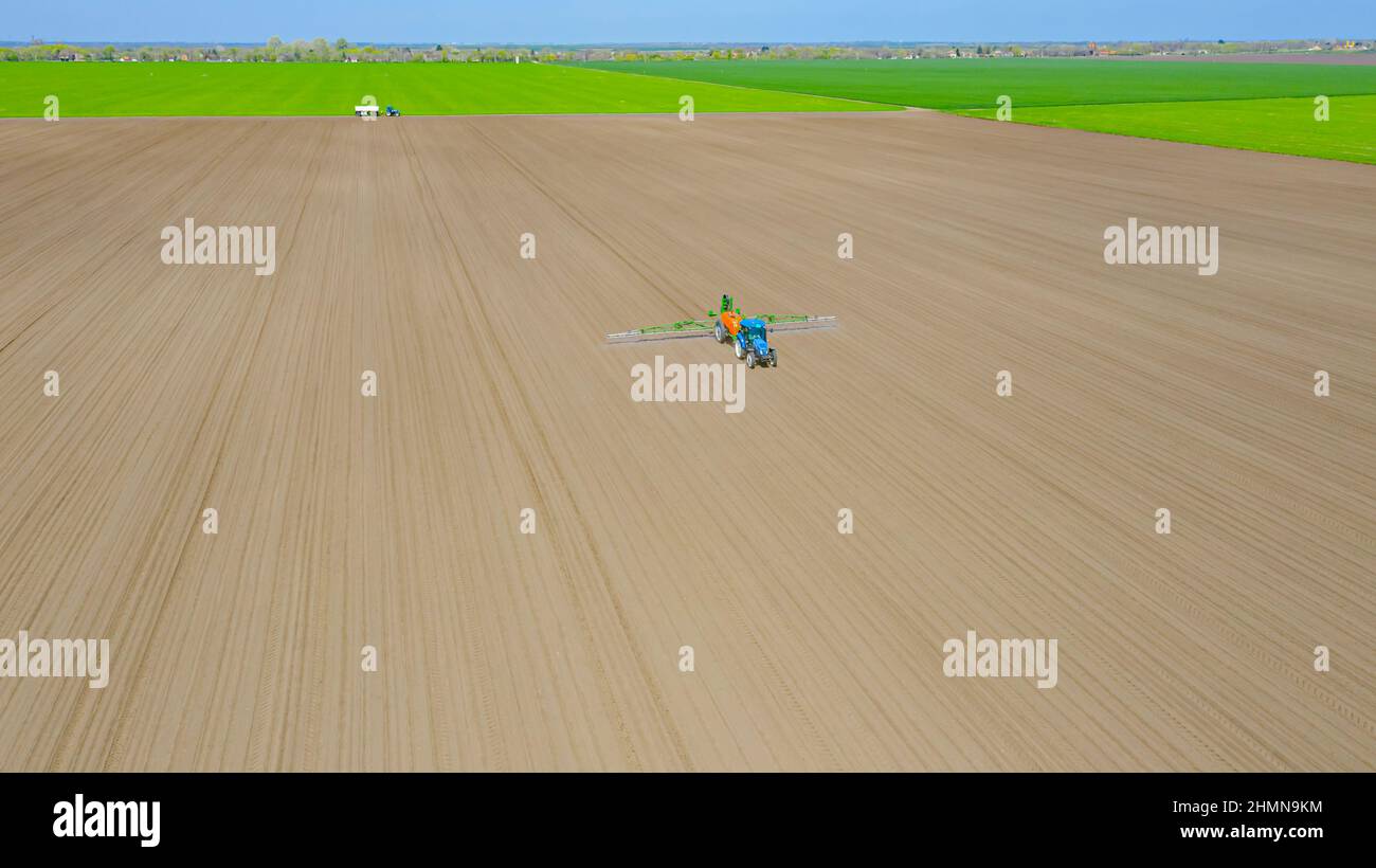 Above view, overhead view on tractor until spraying big endless ...
