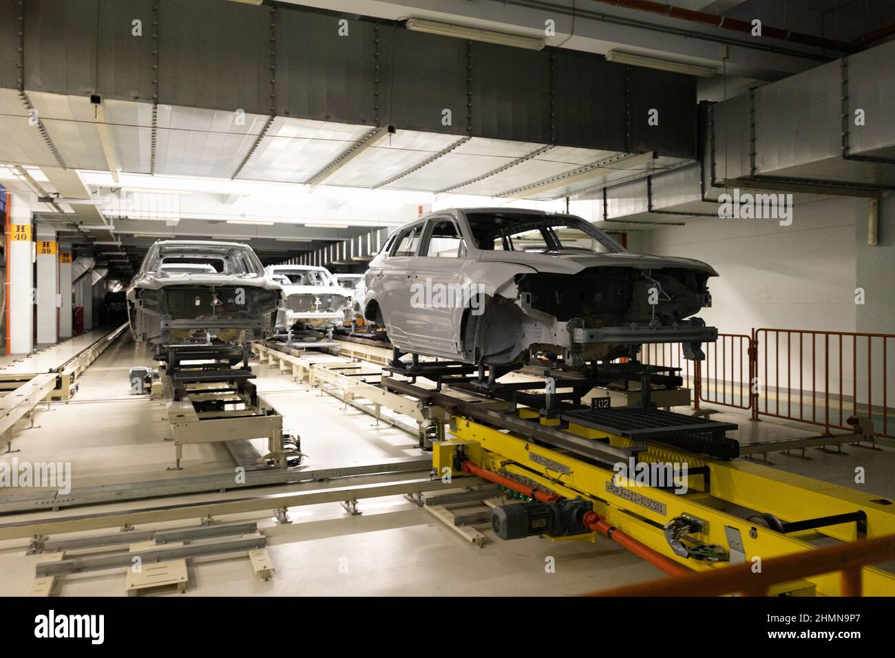 Car bodies are on assembly line. Modern automotive industry. Automobile ...