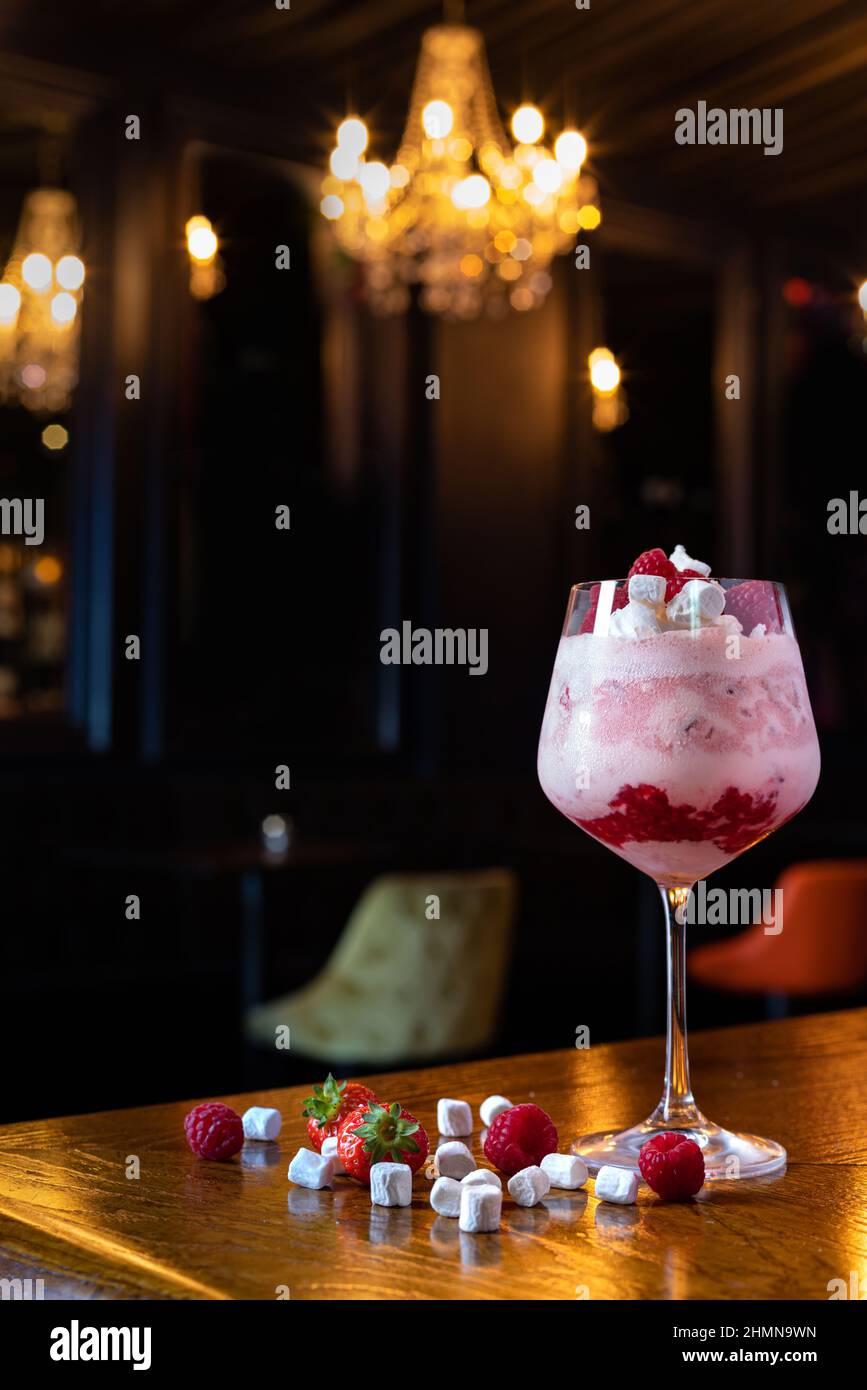 Eton mess raspberry and marshmallow alcoholic cocktail at the night ...