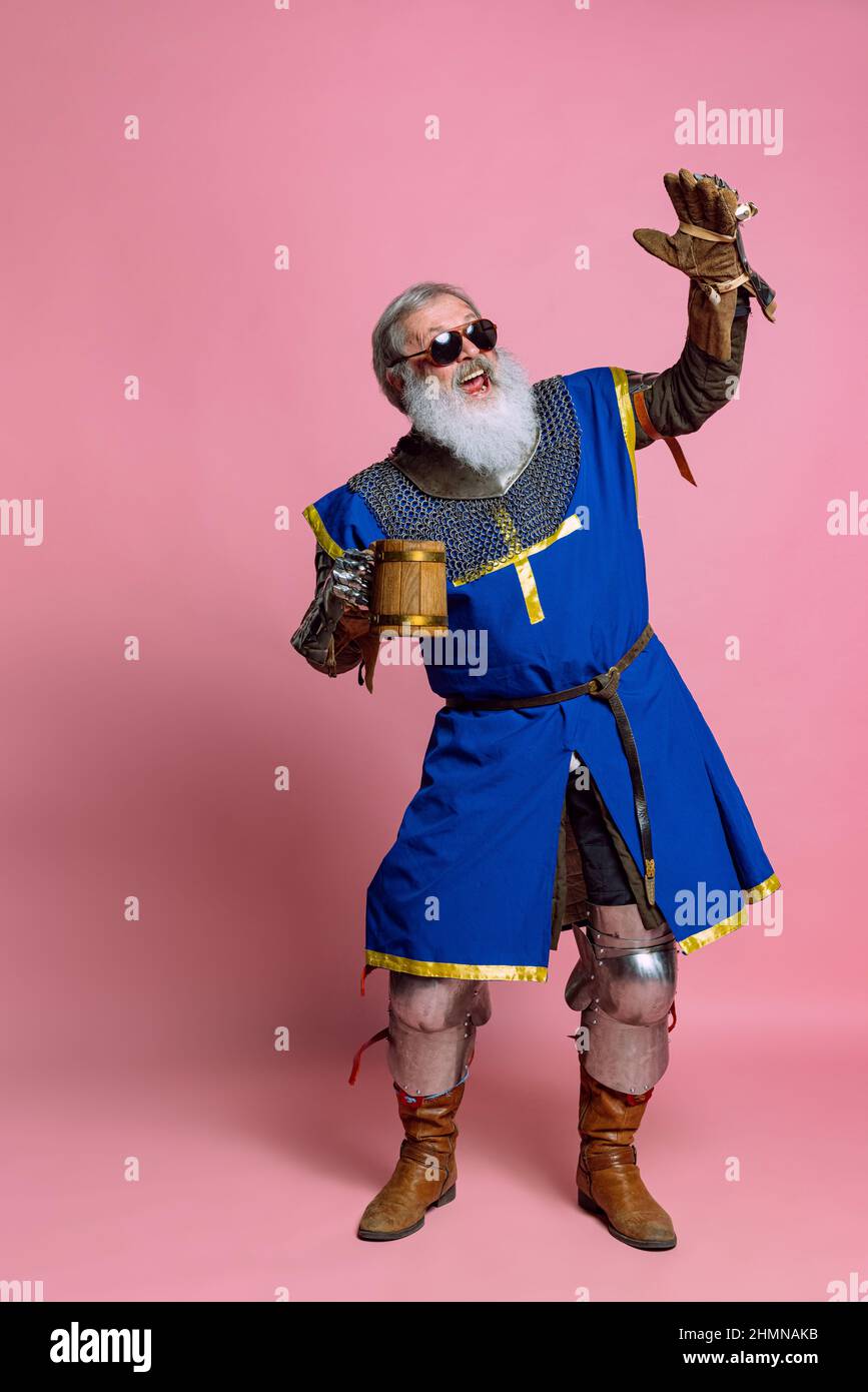 Portrait of senior grey bearded man, brave medieval warrior or knight ...