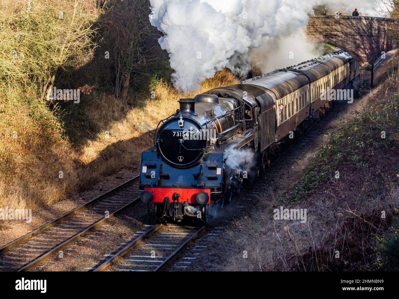 BR Standard steam locomotive Class 5 73156 hauling a passenger train southbound from ...