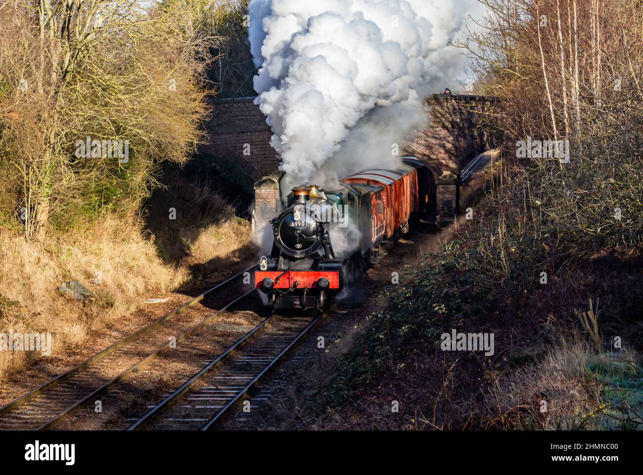 GWR locomotive 6990 Witherslack Hall with a goods train heading south ...