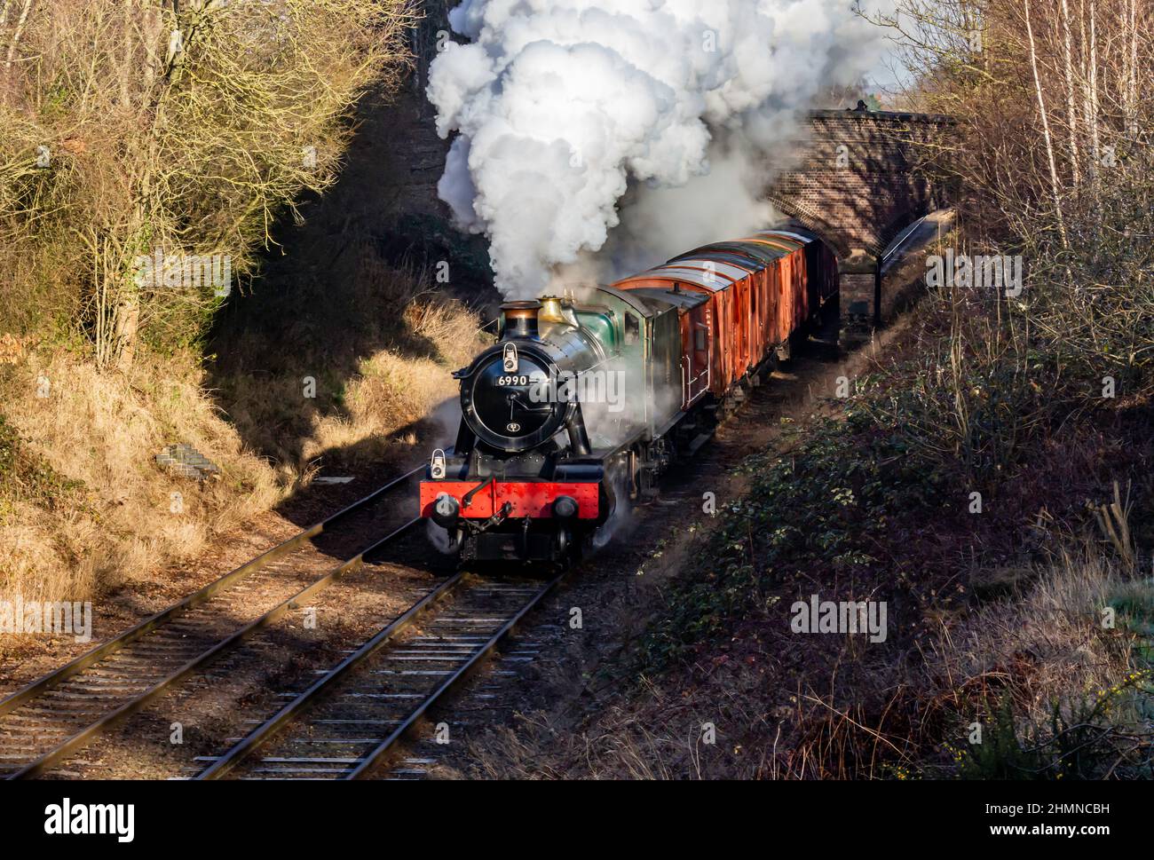 GWR locomotive 6990 Witherslack Hall with a goods train heading south ...