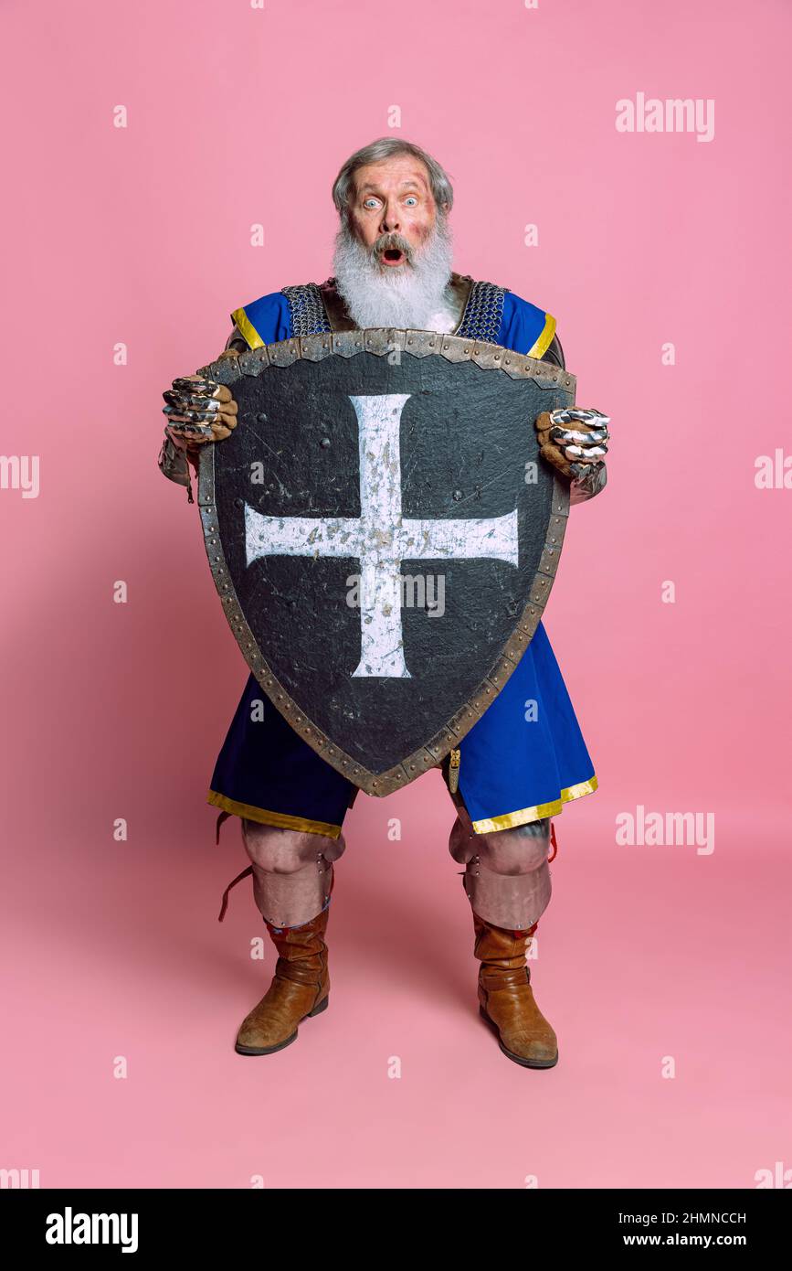 Shock. Portrait of senior grey bearded man, brave medieval warrior or ...
