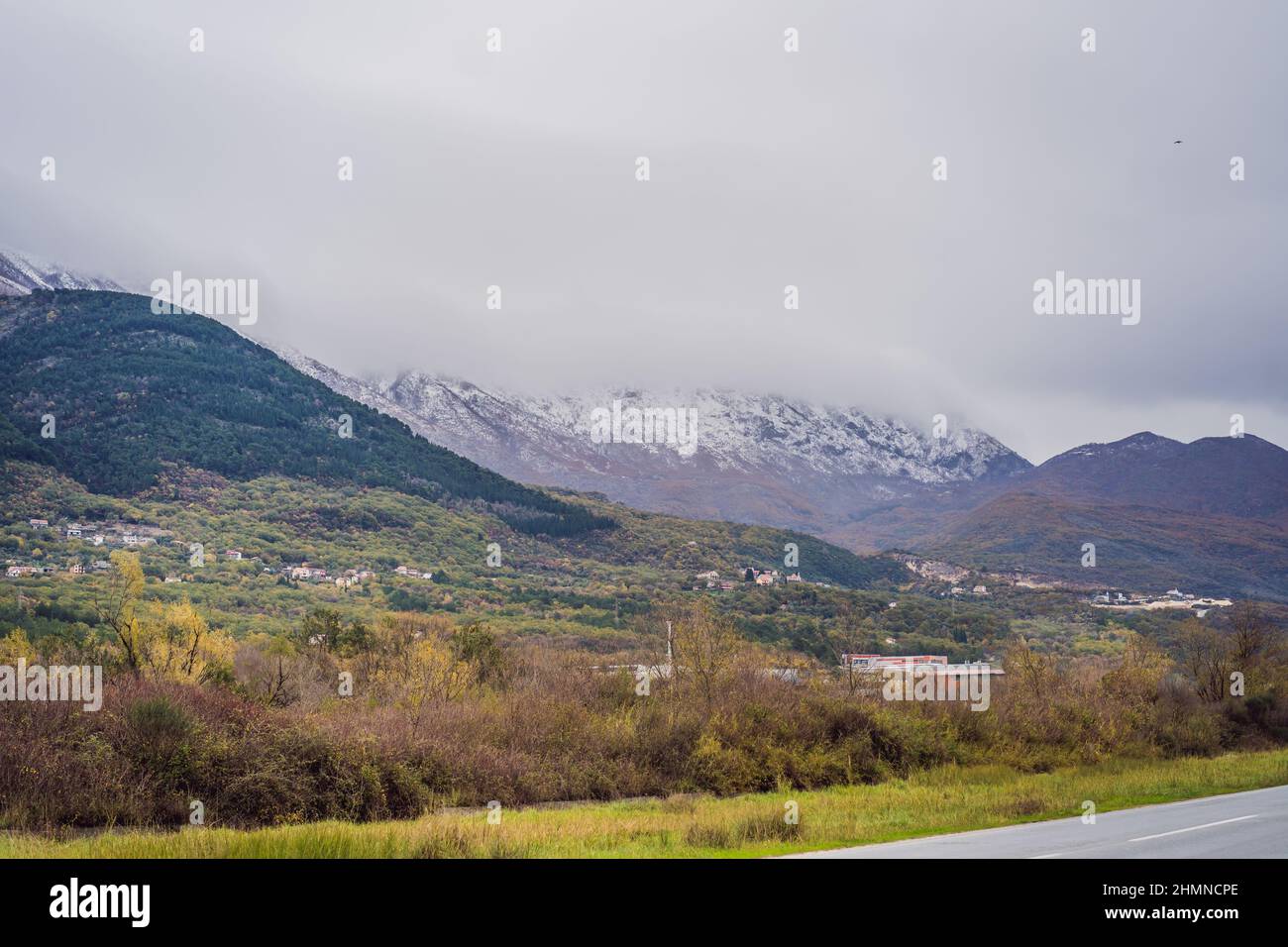 Mountains covered with snow and greenery all around Stock Photo - Alamy