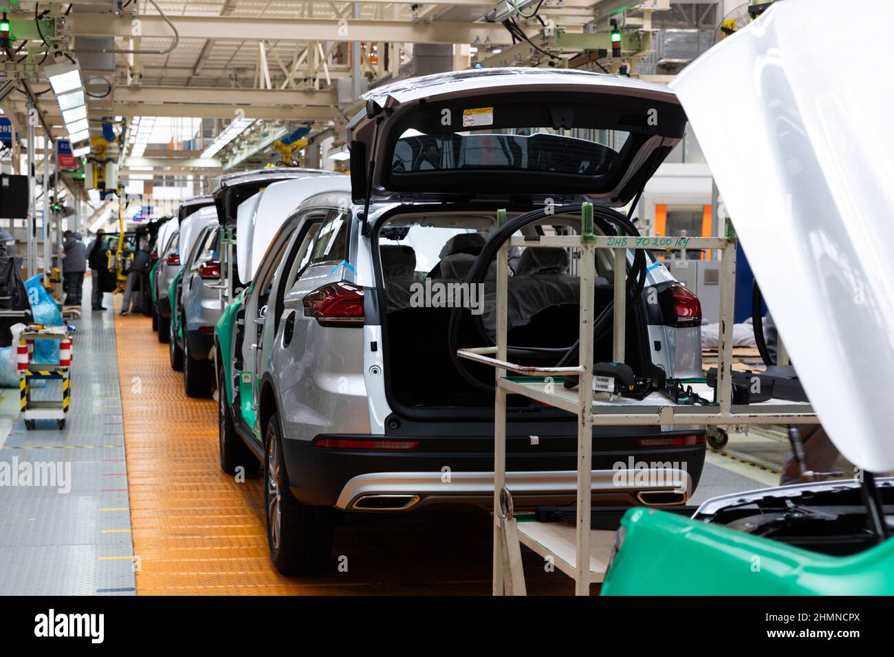 Car bodies are on assembly line. Factory for production of cars. Modern ...