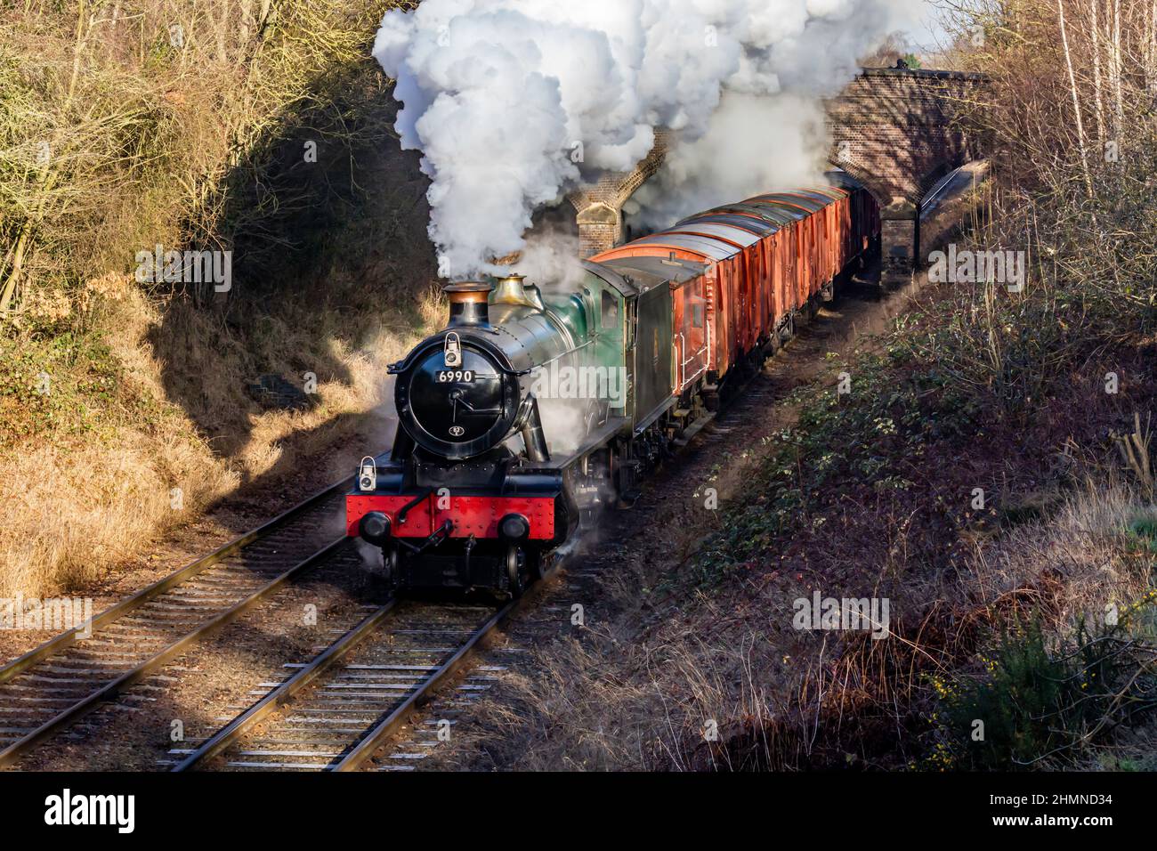 GWR locomotive 6990 Witherslack Hall with a goods train heading south ...