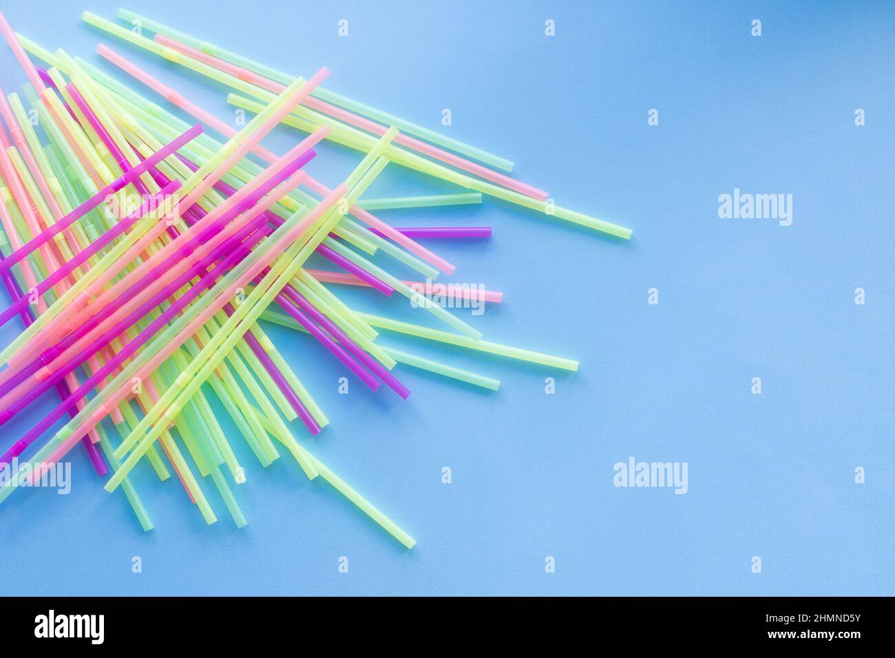 Colored plastic drinking straws on a blue background. Say no for ...