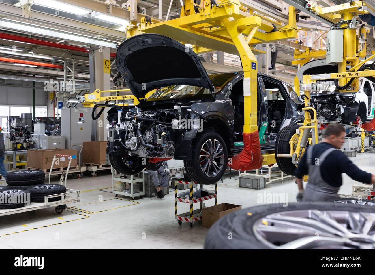 Car bodies are on assembly line. Factory for production of cars. Modern ...